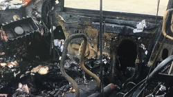 Woman with two Samsung handsets in cart watches as spark becomes fire ...