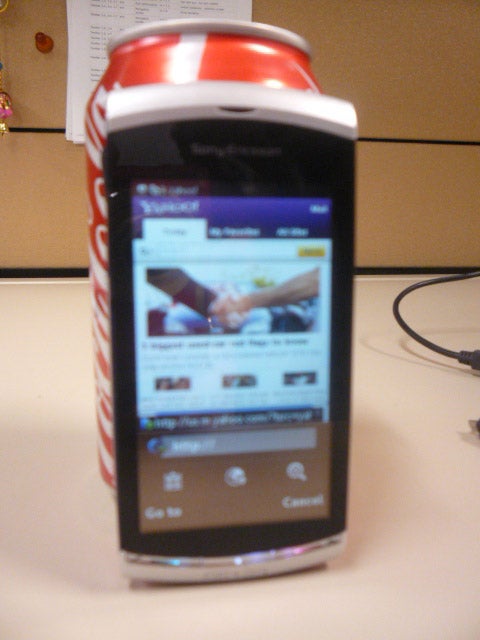 Pictures of the Sony Ericsson Kurara and a Coca-Cola can - PhoneArena